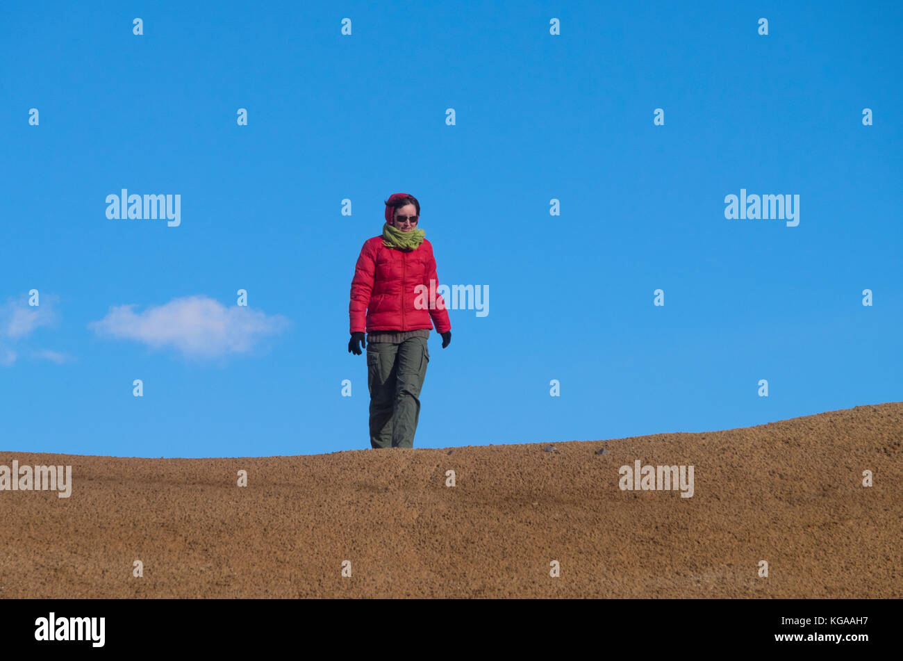 Young woman walking alone Stock Photo - Alamy