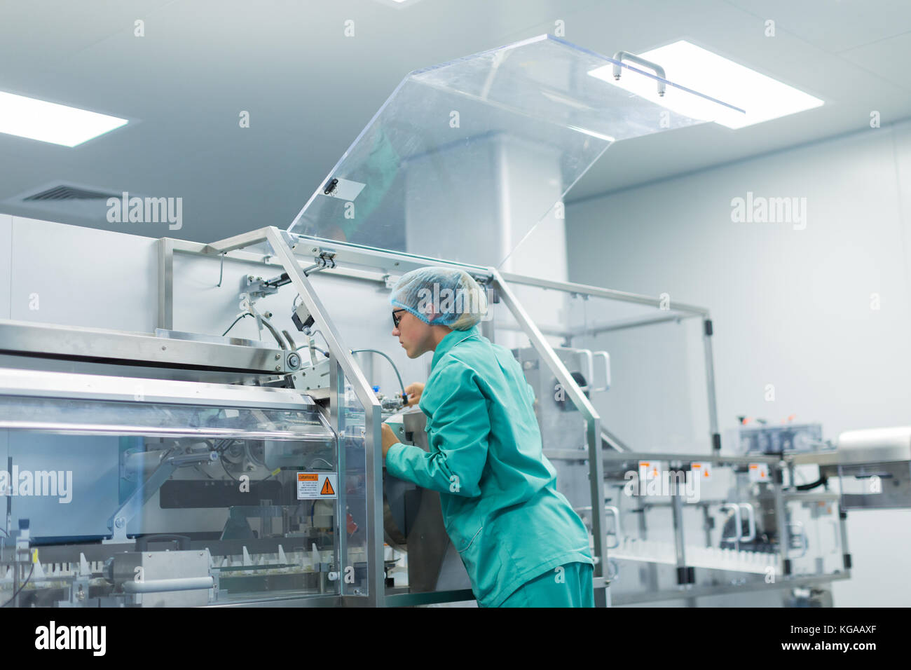 the operator controls the machine in the factory work Stock Photo - Alamy
