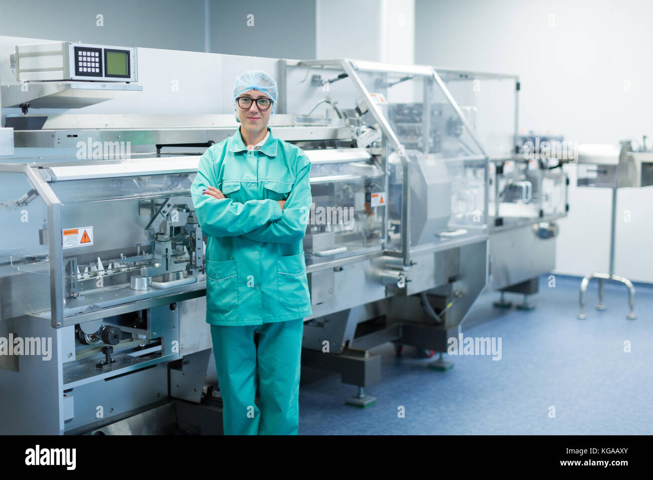 operator in the pharmaceutical factory near the equipment Stock Photo ...