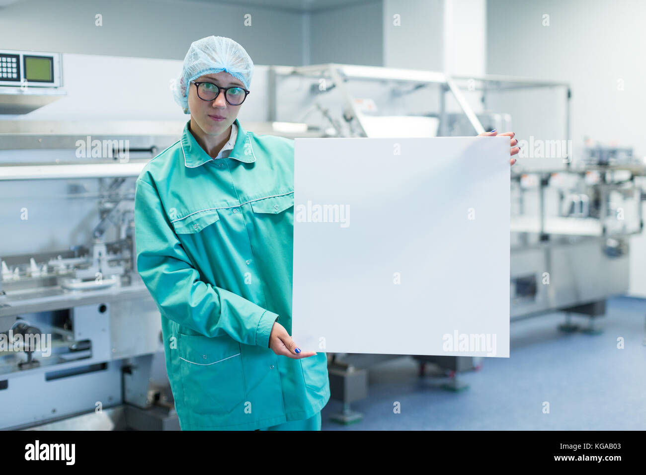 pharmaceutical factory worker shows Equipment Stock Photo - Alamy