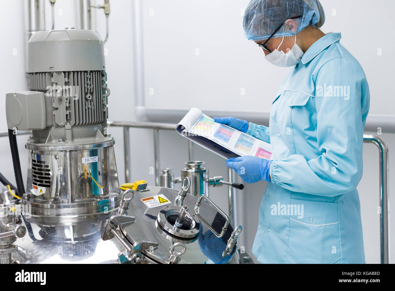 Inspector in the production control process Stock Photo - Alamy