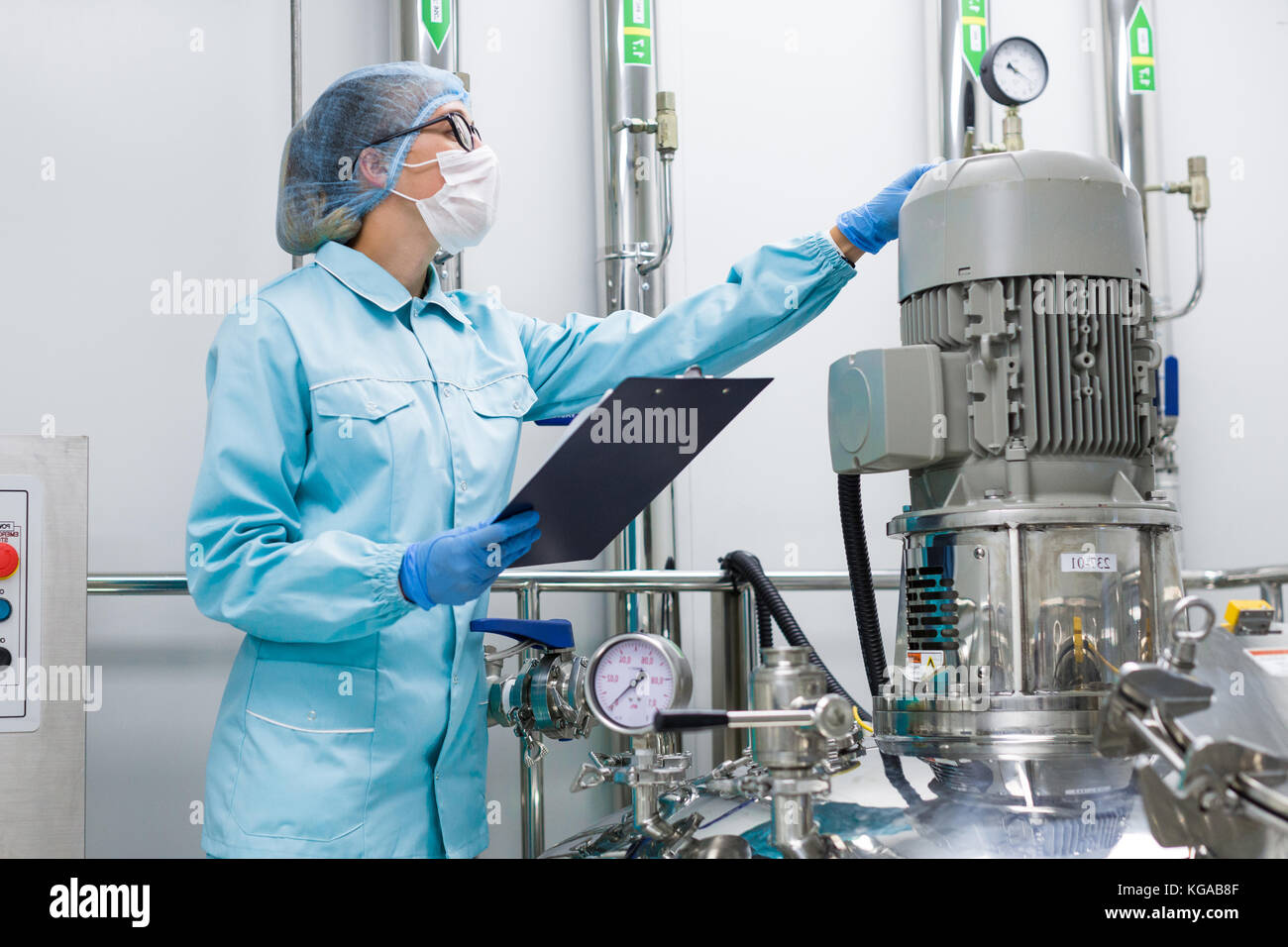 scientist monitors the readings on the equipment Stock Photo - Alamy