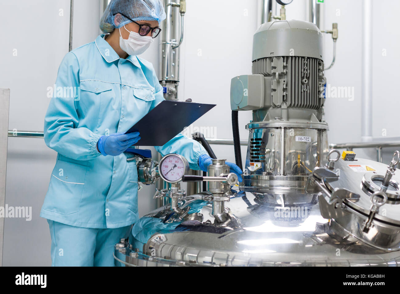 Inspector in the production control process Stock Photo - Alamy