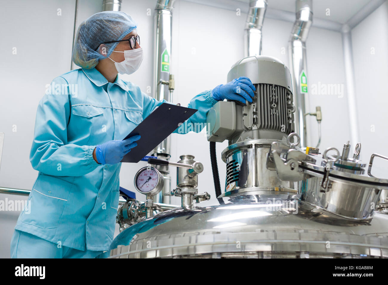scientist monitors the readings on the equipment Stock Photo - Alamy