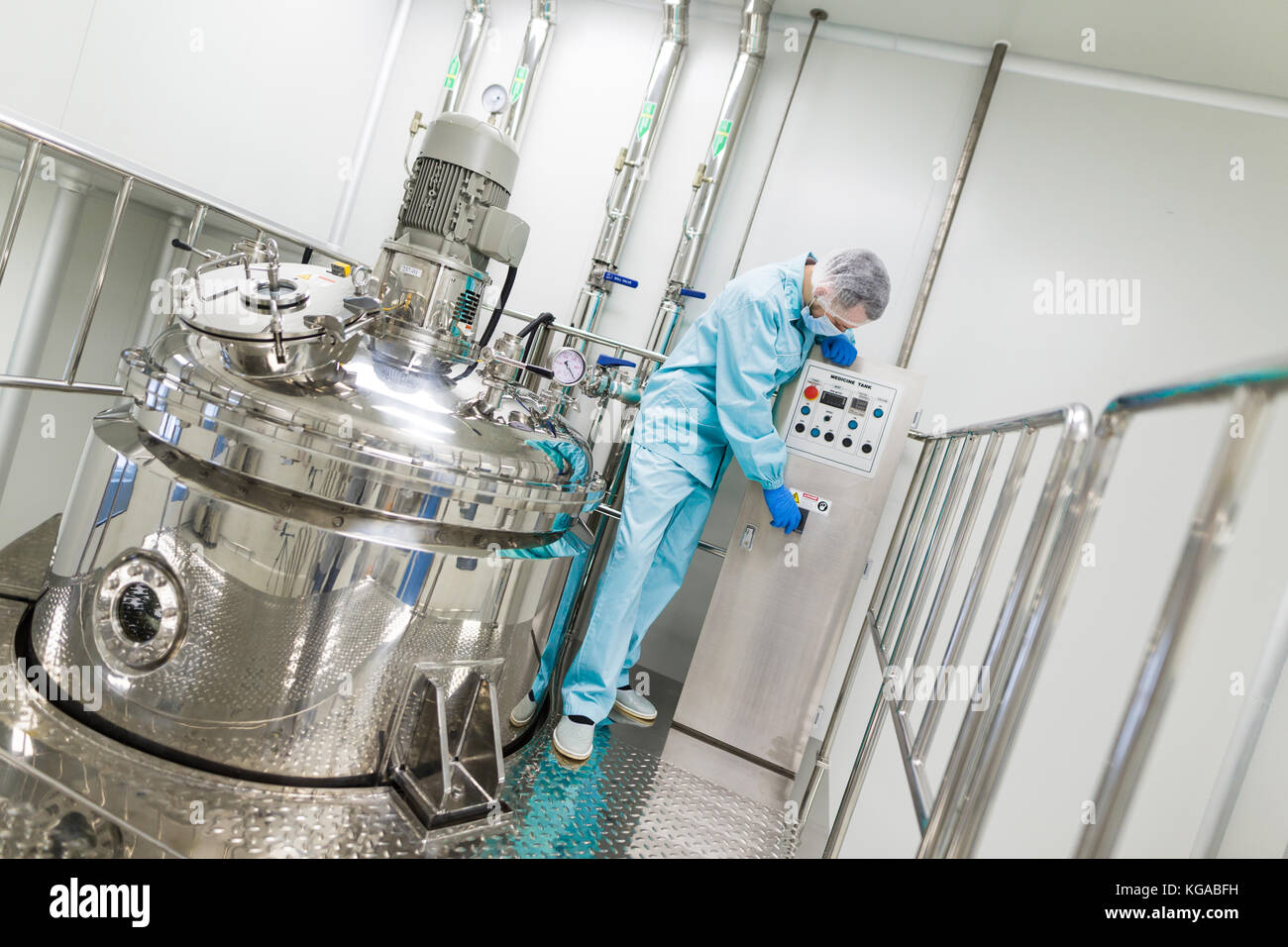 scientist is working with control panel Stock Photo - Alamy