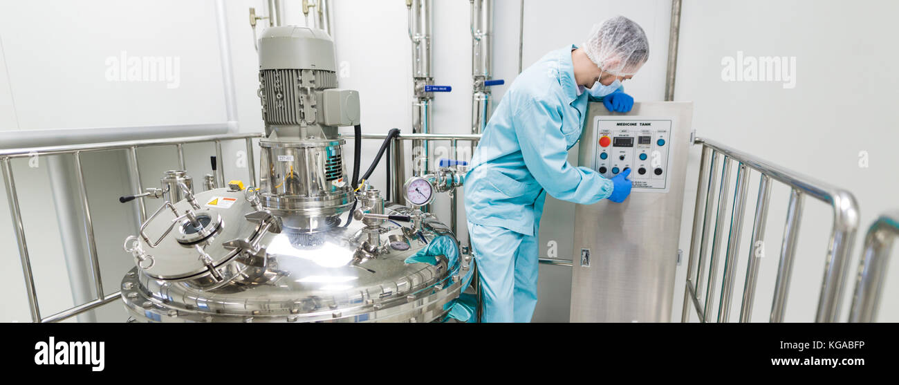 scientist is working with control panel Stock Photo - Alamy