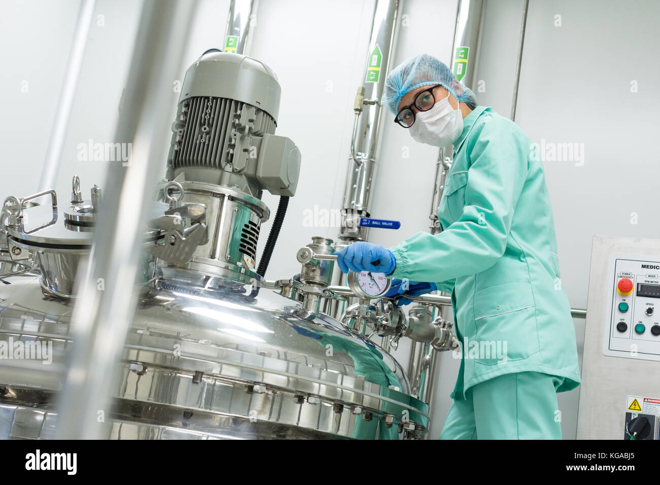 science worker checking howequipment work Stock Photo - Alamy