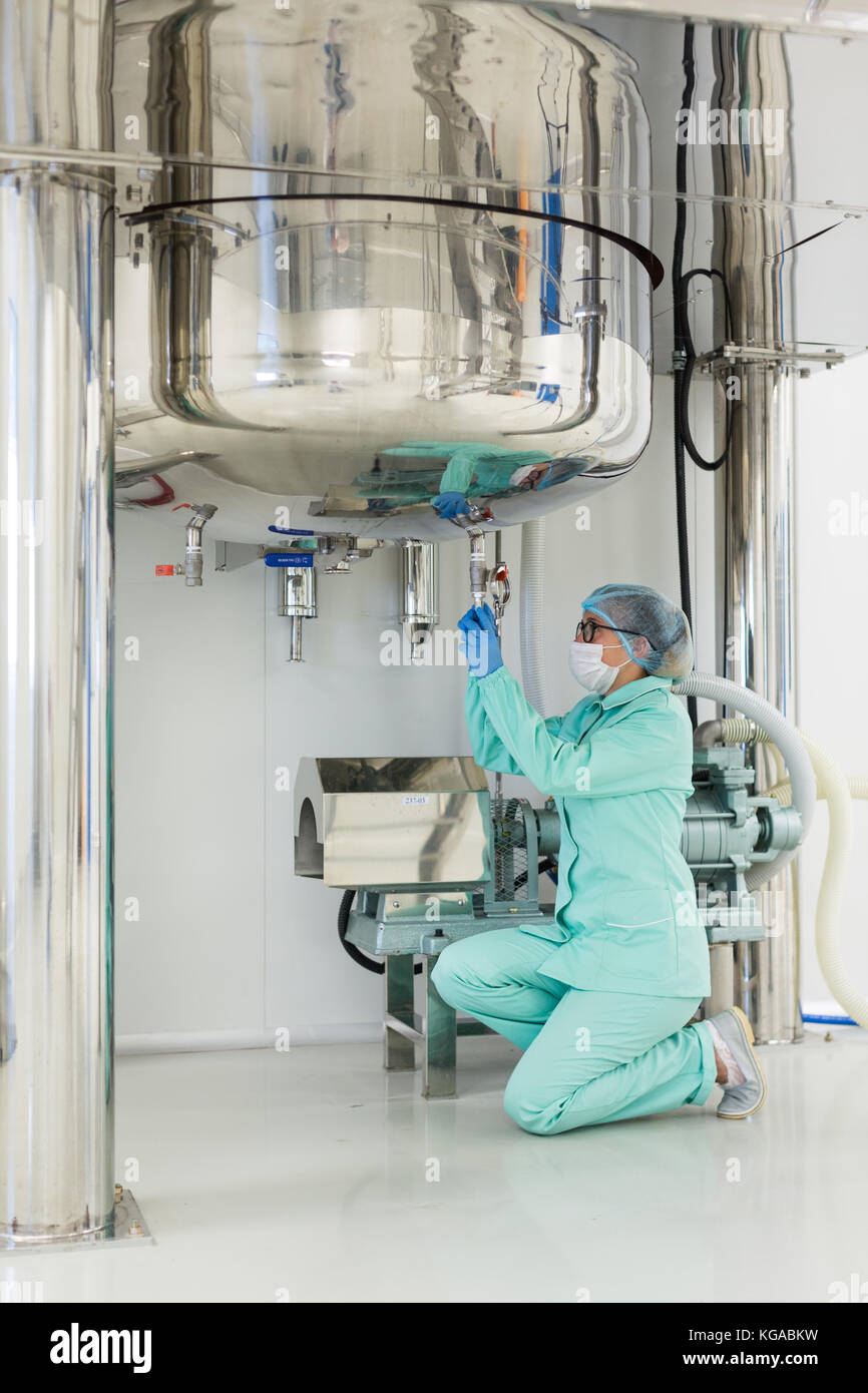 scientist is working with steel tank Stock Photo - Alamy