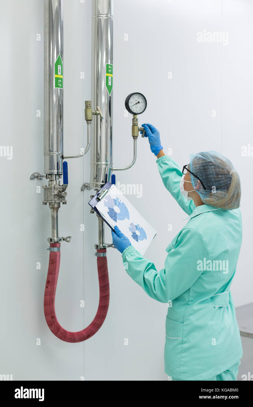 science worker check pressure meter Stock Photo - Alamy