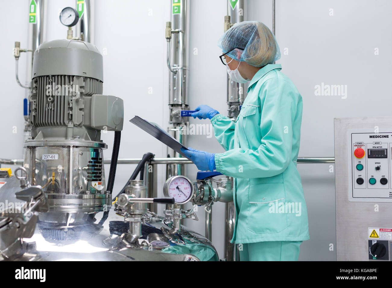 plant picture, scientist standing near big steel tank with table Stock ...