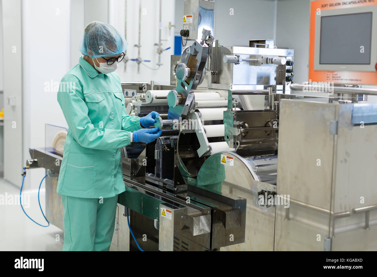 factory worker stand, work with control panel Stock Photo - Alamy