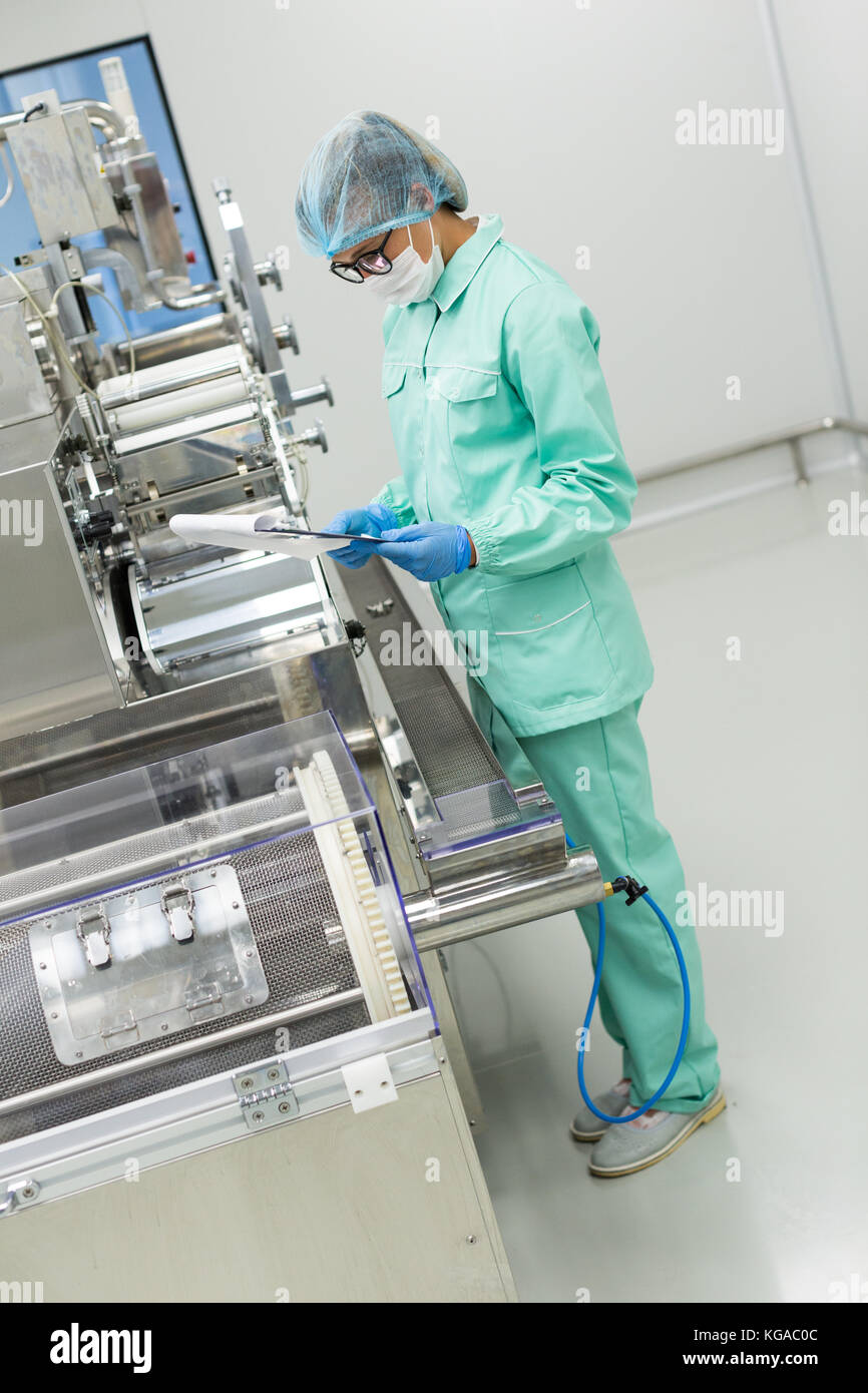 factory worker fix machine Stock Photo - Alamy