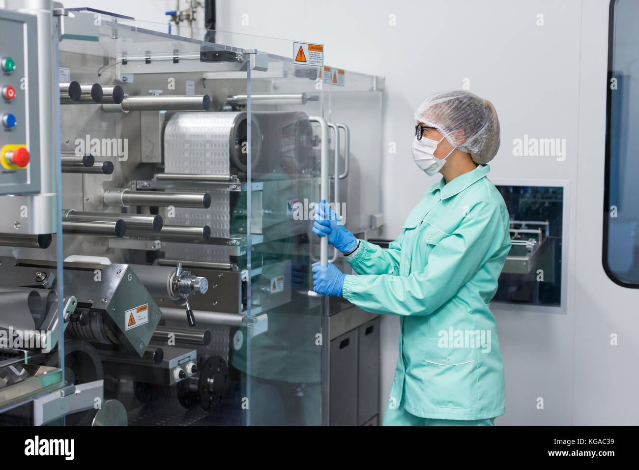 factory worker study how machine work Stock Photo - Alamy