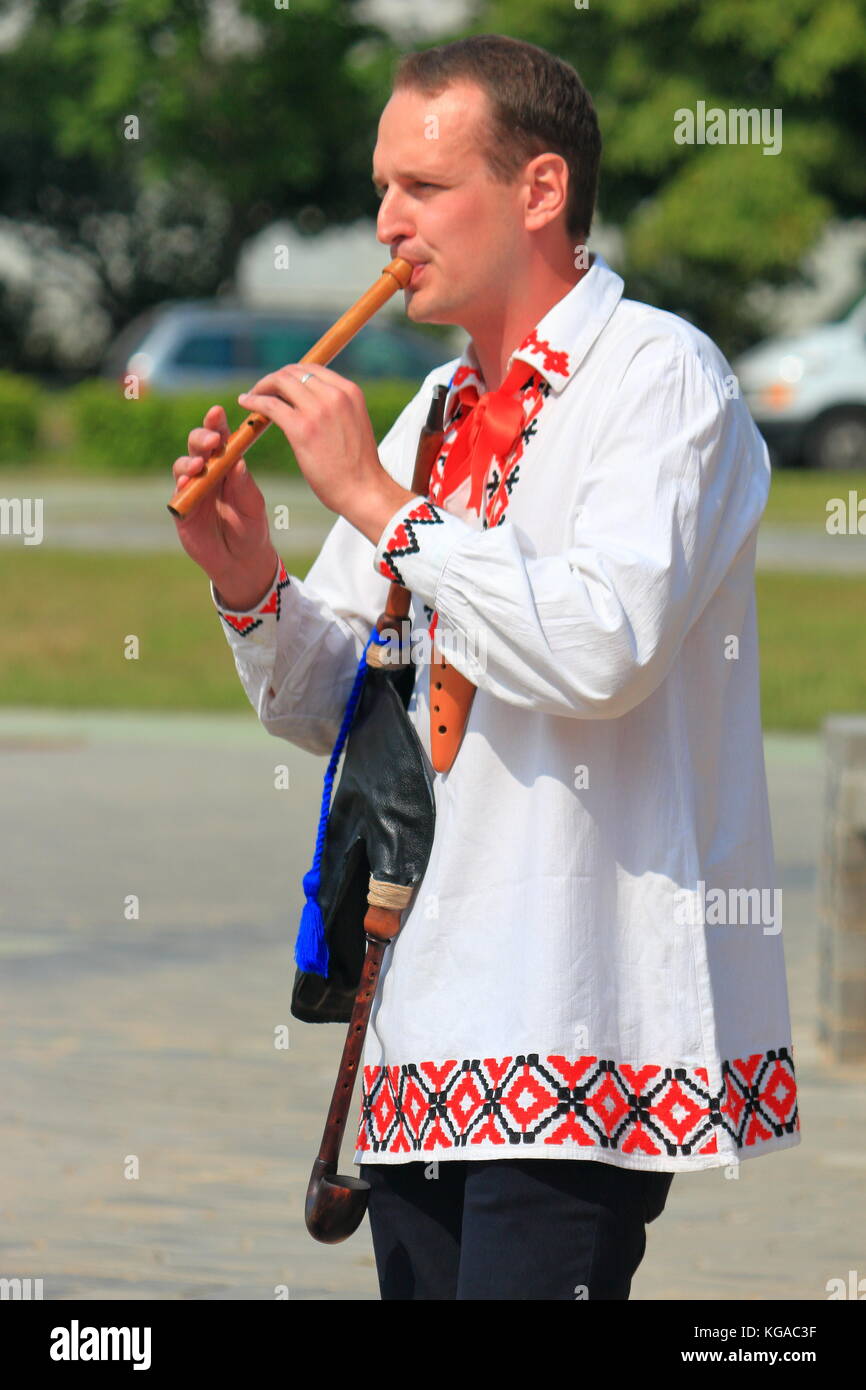 Performance of the professional musician with a pipe Stock Photo - Alamy
