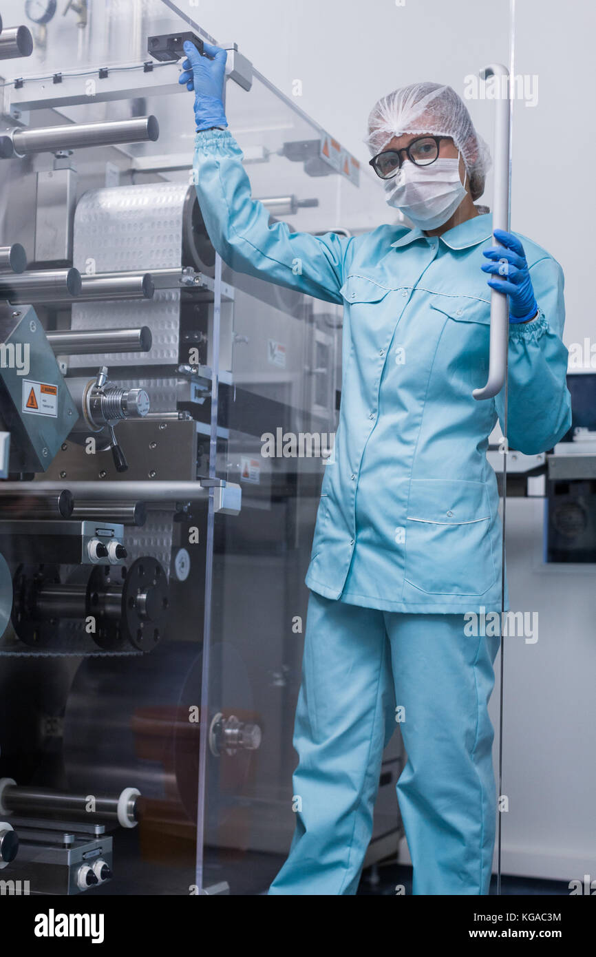 factory worker work with machine Stock Photo - Alamy