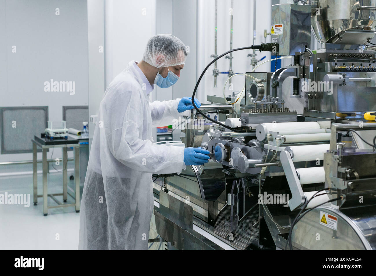 factory worker is configuring the machine Stock Photo - Alamy