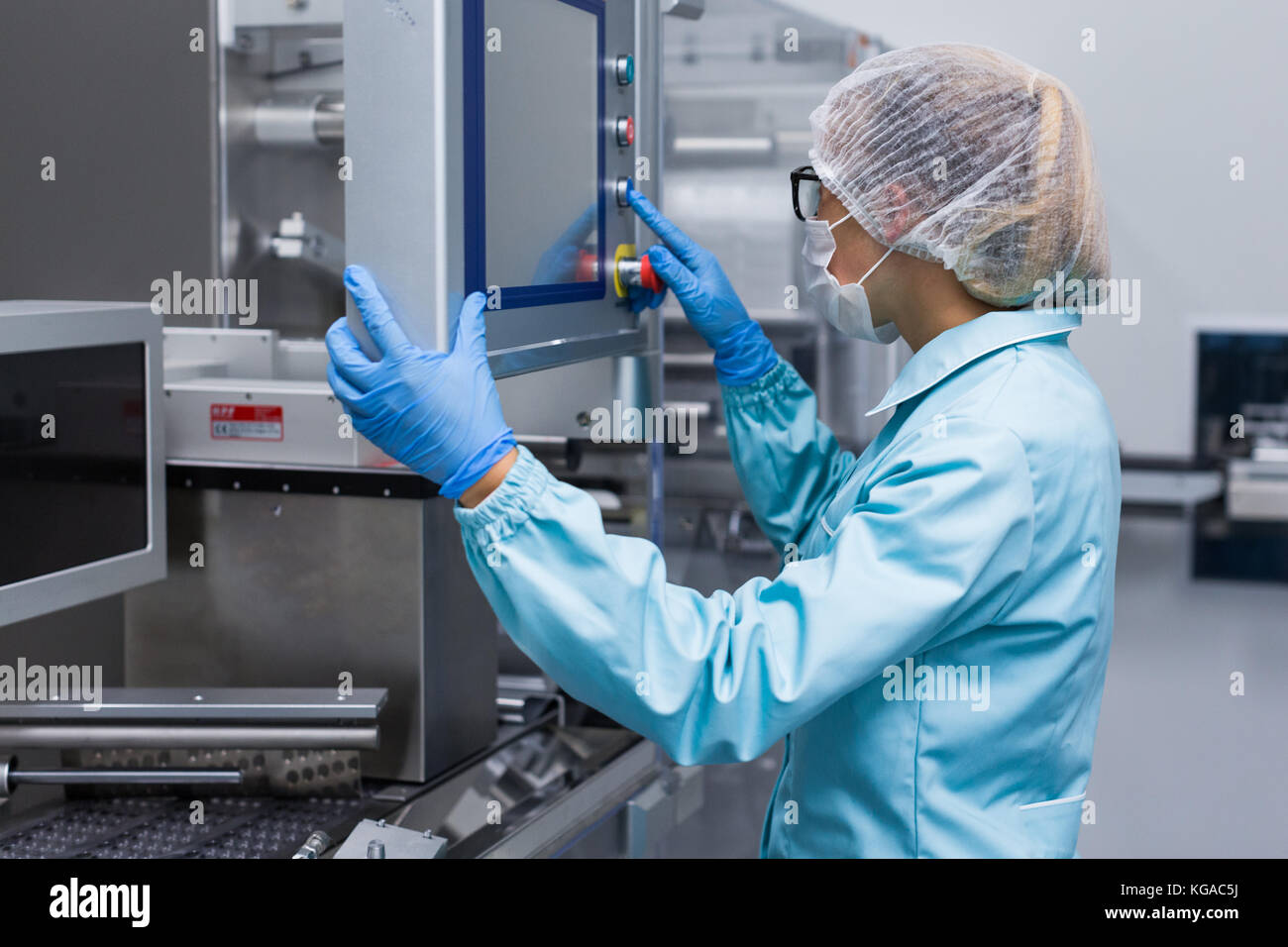 factory worker configures control panel Stock Photo - Alamy
