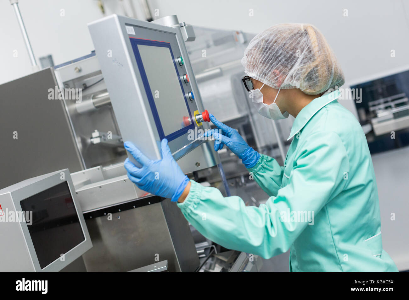 factory worker configures control panel Stock Photo - Alamy