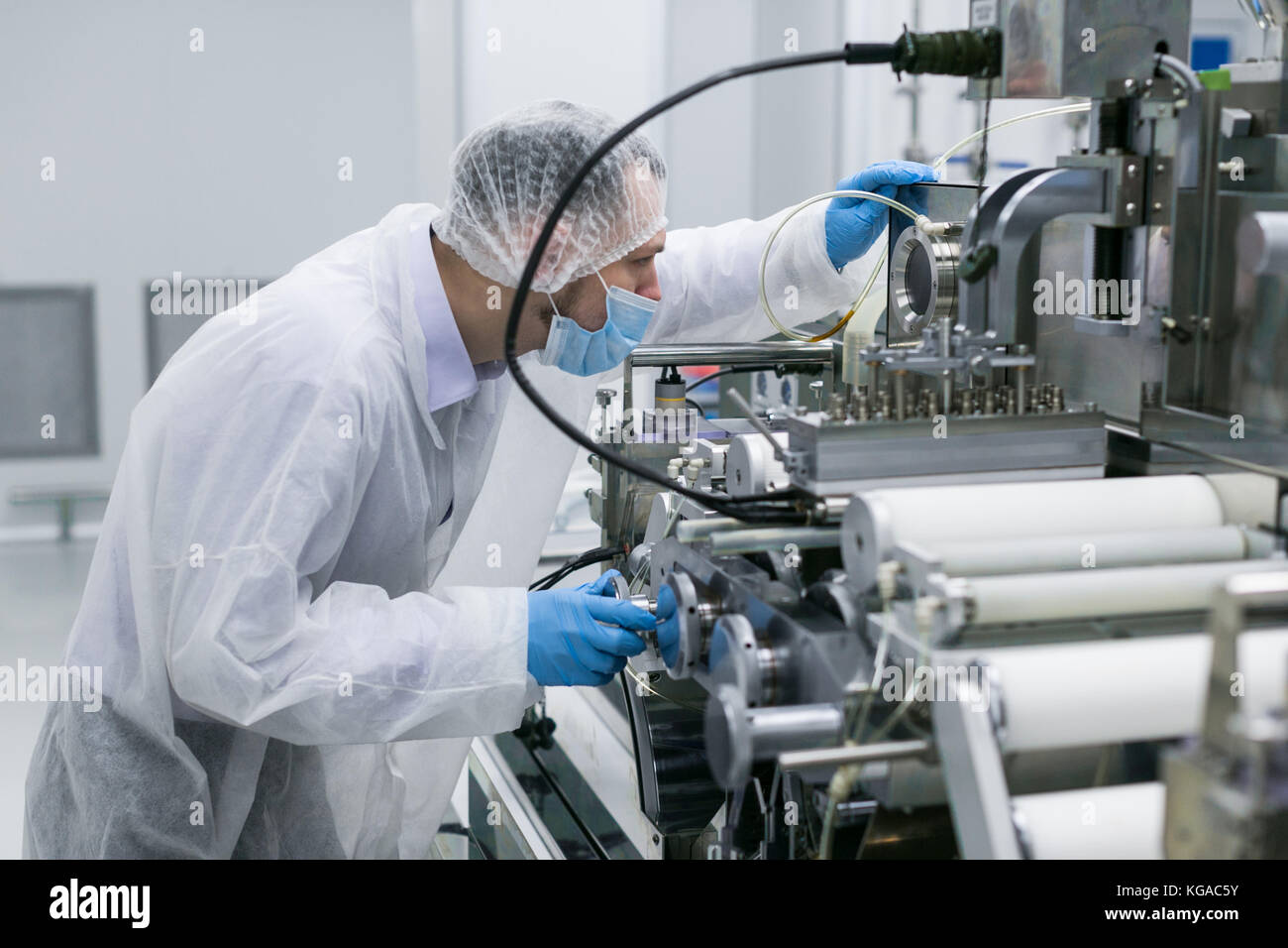 scientist work with manufacture machine in lab Stock Photo - Alamy