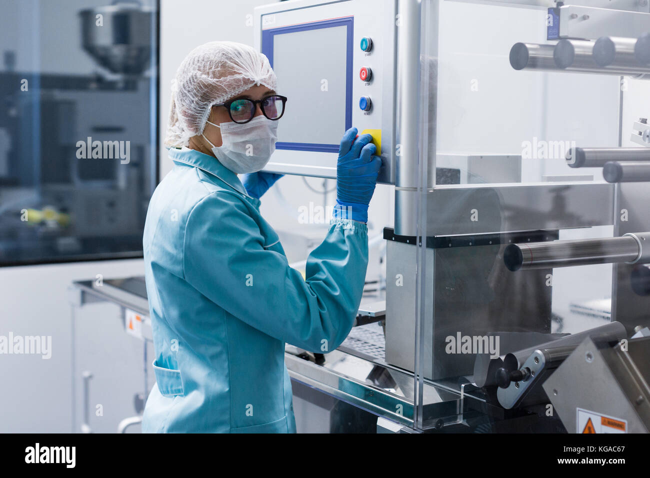 factory worker configures control panel Stock Photo - Alamy