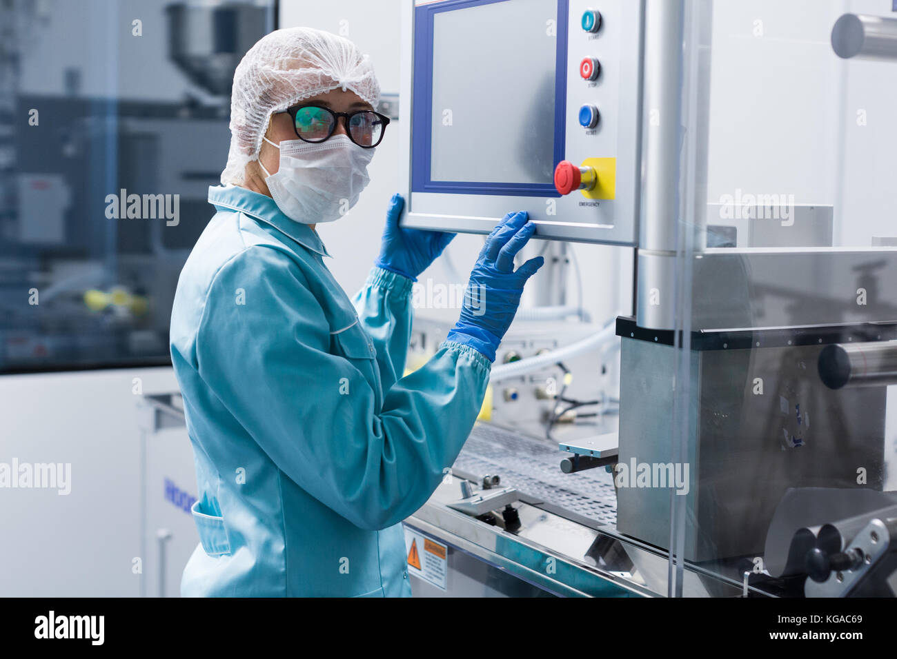 factory worker configures control panel Stock Photo - Alamy