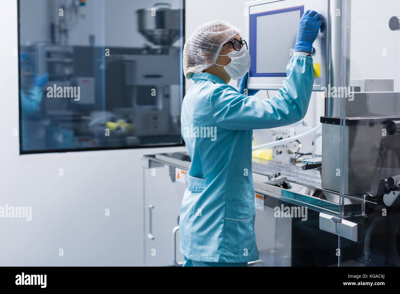 factory worker configures control panel Stock Photo - Alamy