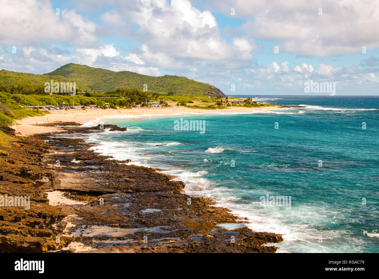 Sandy beach coast green hills hi-res stock photography and images - Alamy
