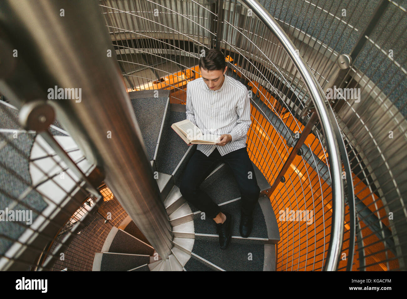 Reading book on steps hi-res stock photography and images - Alamy