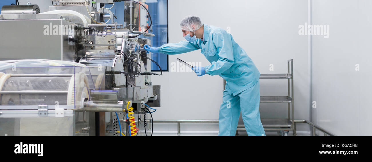 widescreen picture, scientist configures control panel Stock Photo - Alamy