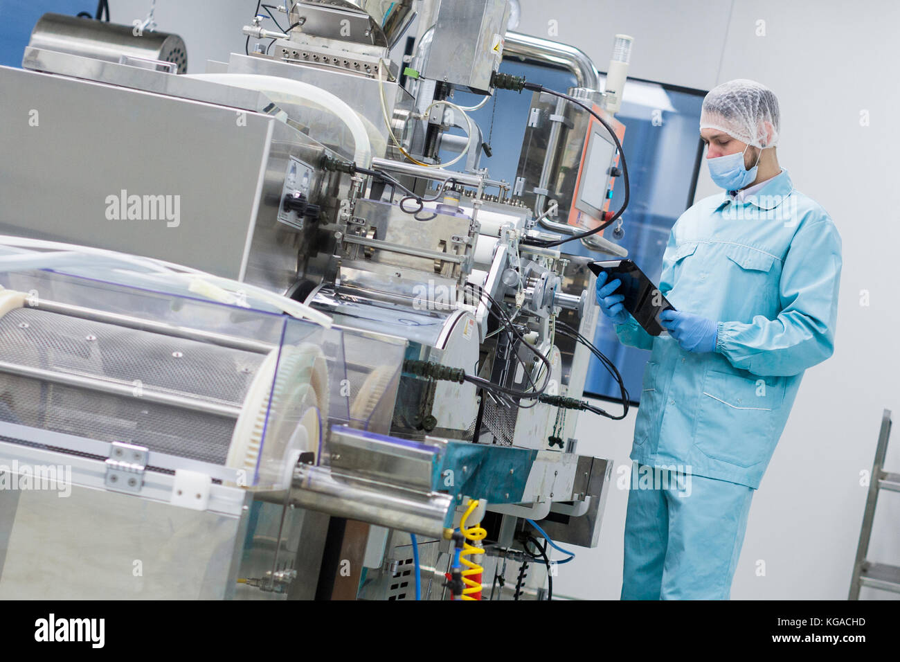 scientist configure machine with shafts Stock Photo - Alamy