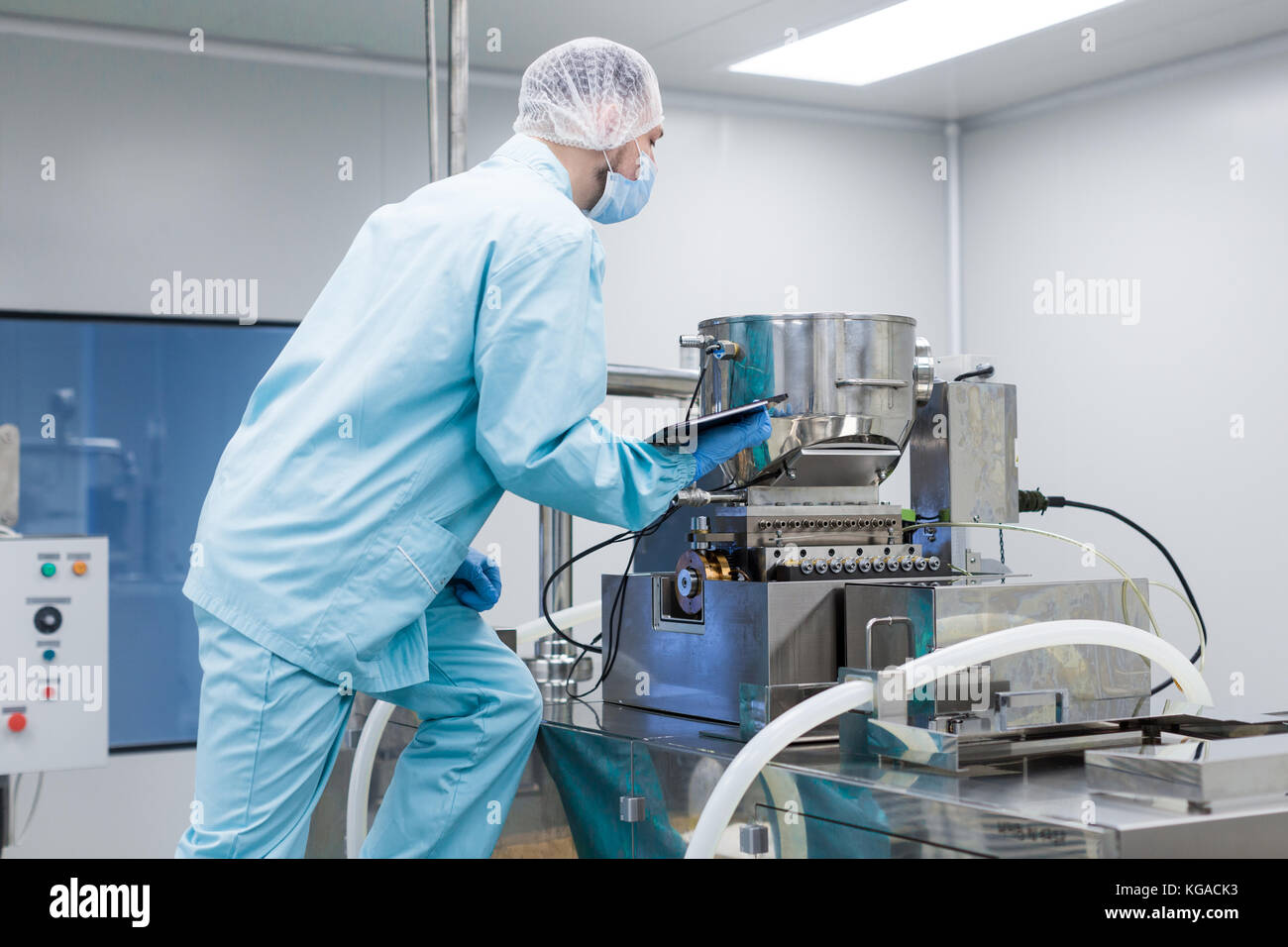 plant picture, factory worker making notes about machine Stock Photo ...