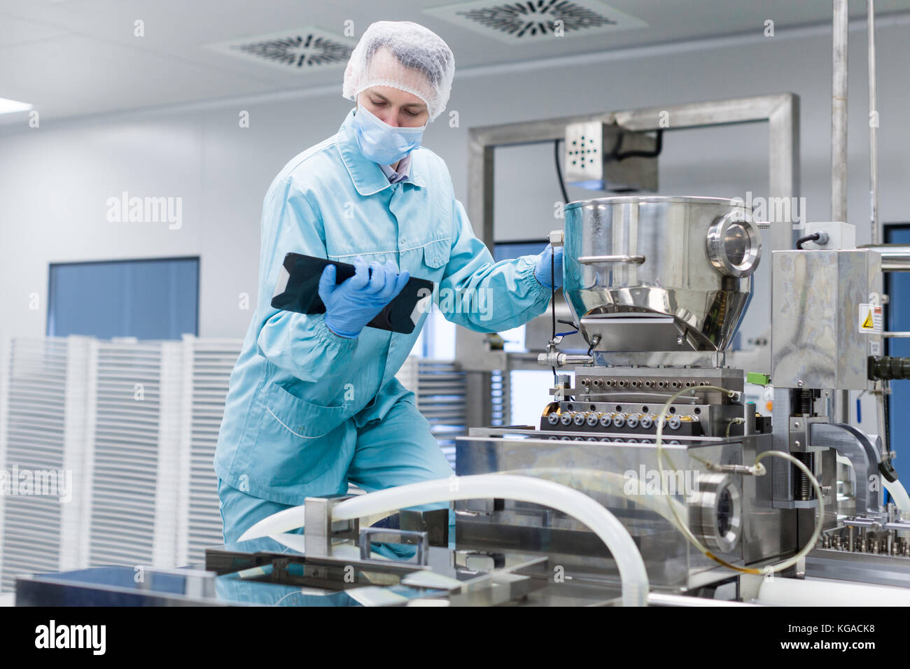plant picture, factory worker making notes about machine Stock Photo ...