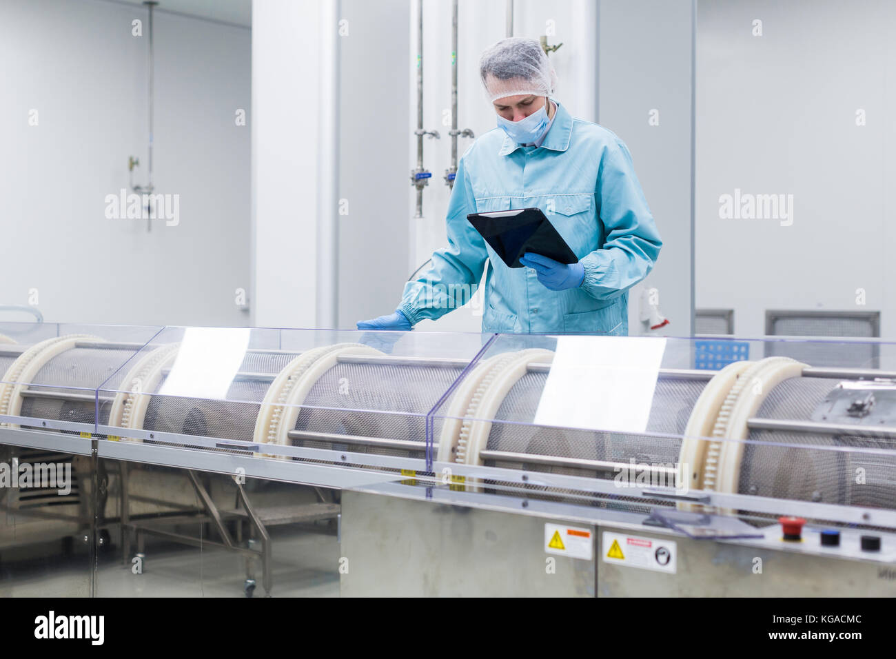 scientist making notes about machine Stock Photo - Alamy