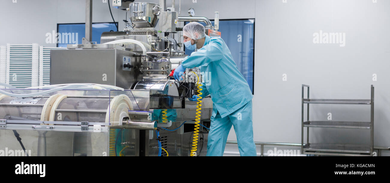 scientist configure machine with shafts Stock Photo - Alamy