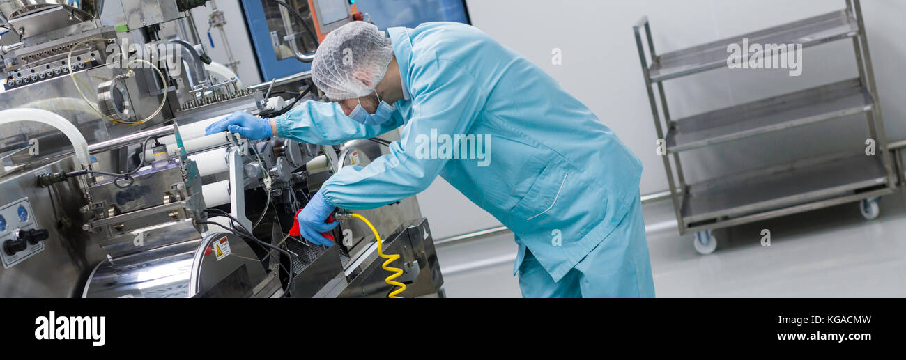 widescreen picture, factory worker work with machine, steel mach Stock ...