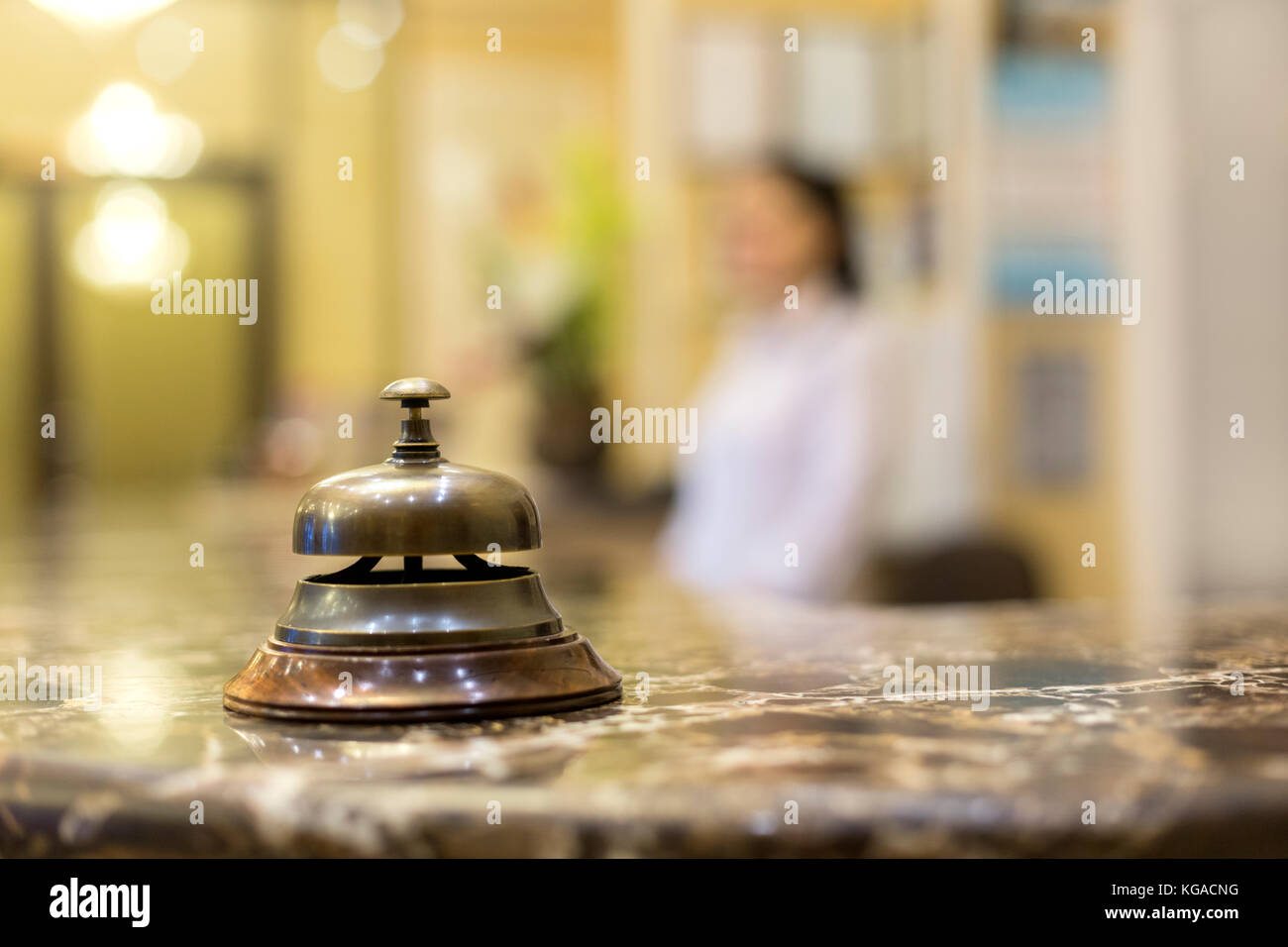 Modern luxury hotel reception counter desk with bell Stock Photo - Alamy