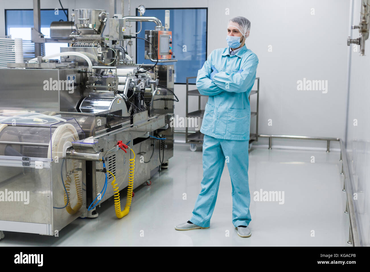 scientist look at machines Stock Photo - Alamy