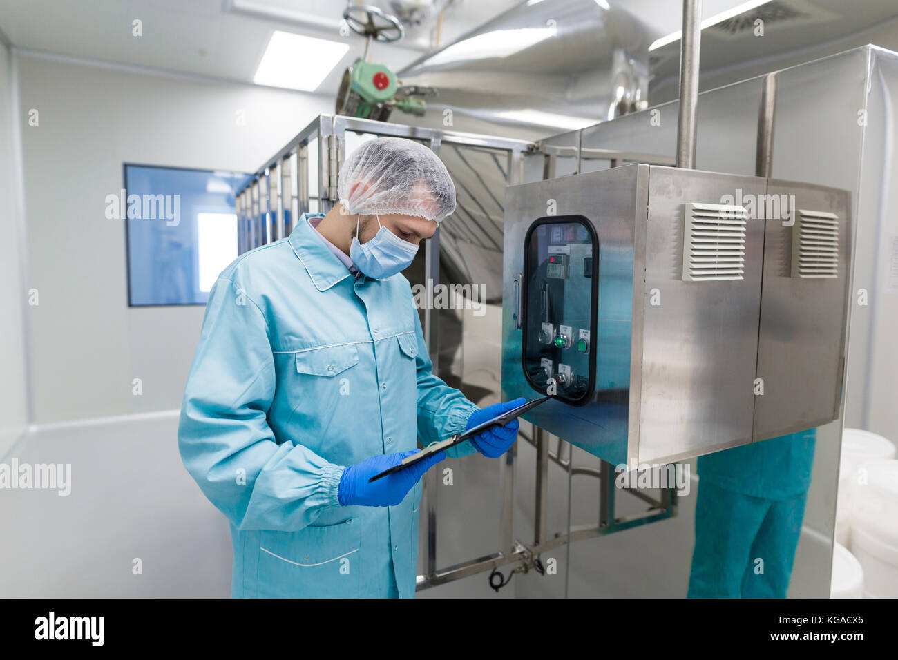 scientist stand near control panel Stock Photo - Alamy