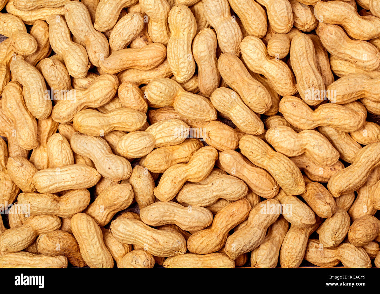 Peanuts in shell texture background. Raw peanuts on display at a farmer ...