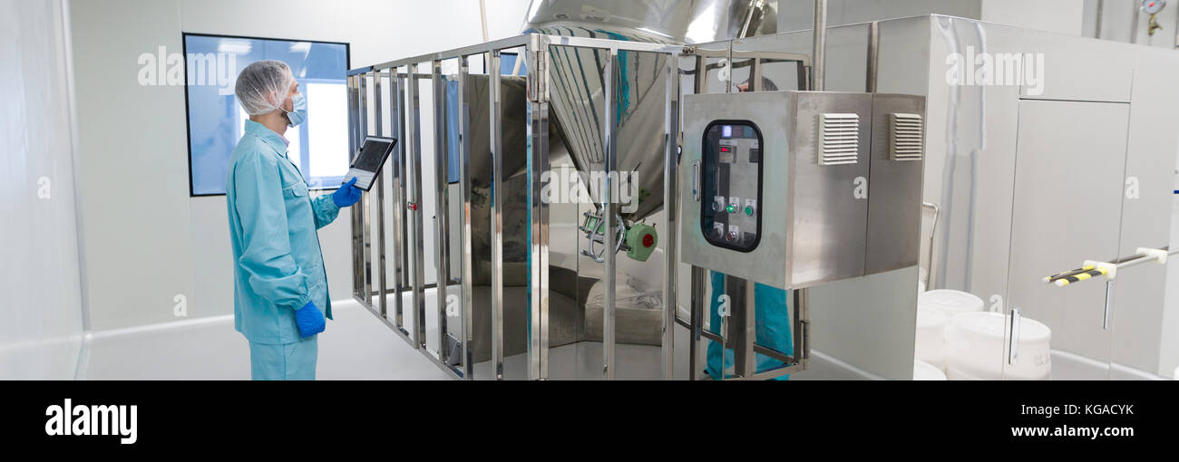 scientist stand near control panel Stock Photo - Alamy