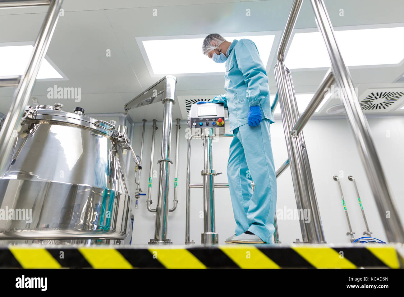 scientist configure control panel near metal tank Stock Photo - Alamy