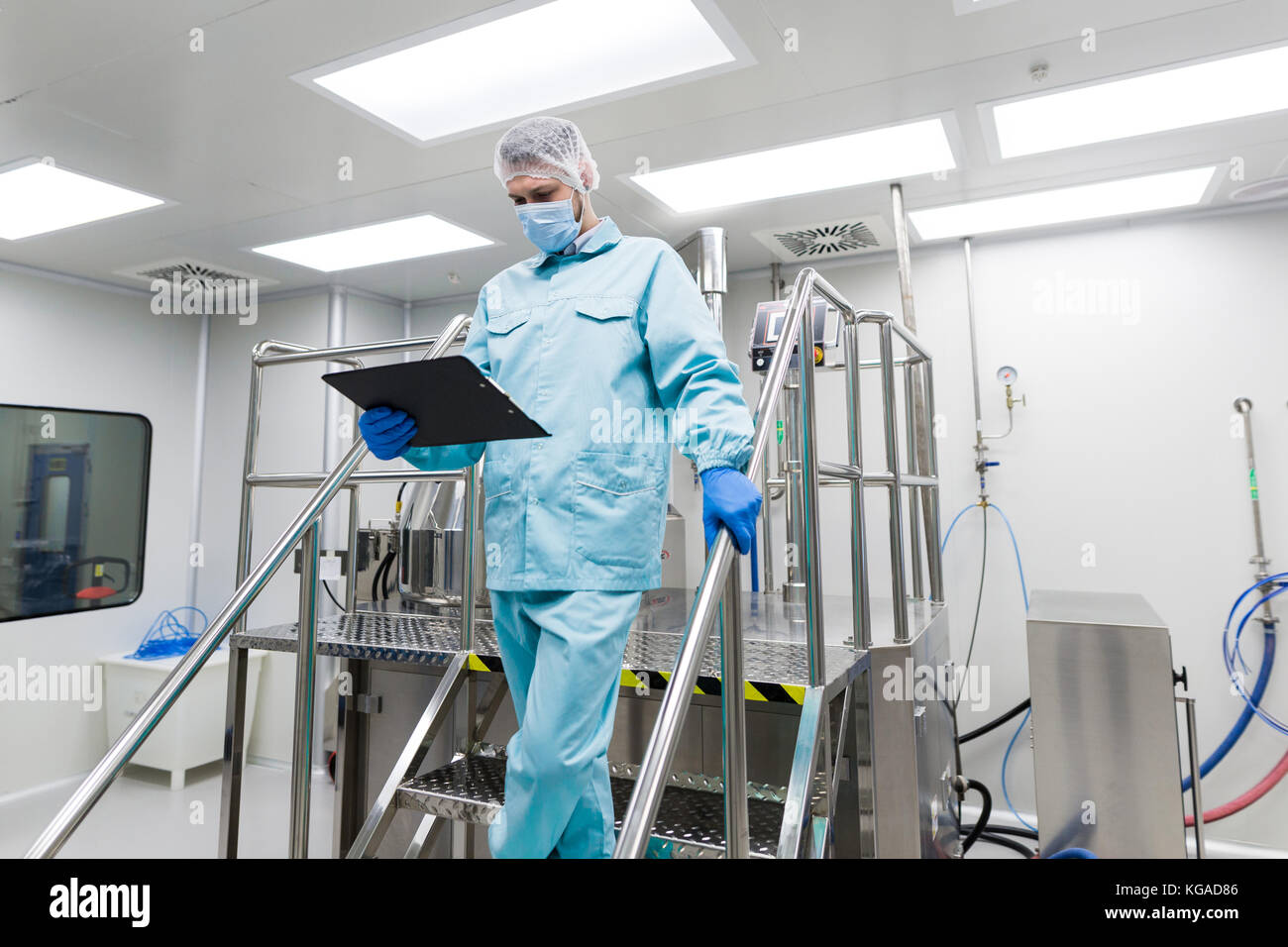 scientist stand on metal stairs in laboratory Stock Photo - Alamy