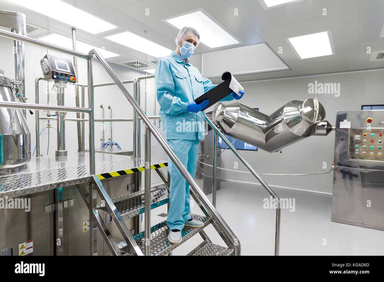 scientist stand on metal stairs in laboratory Stock Photo - Alamy