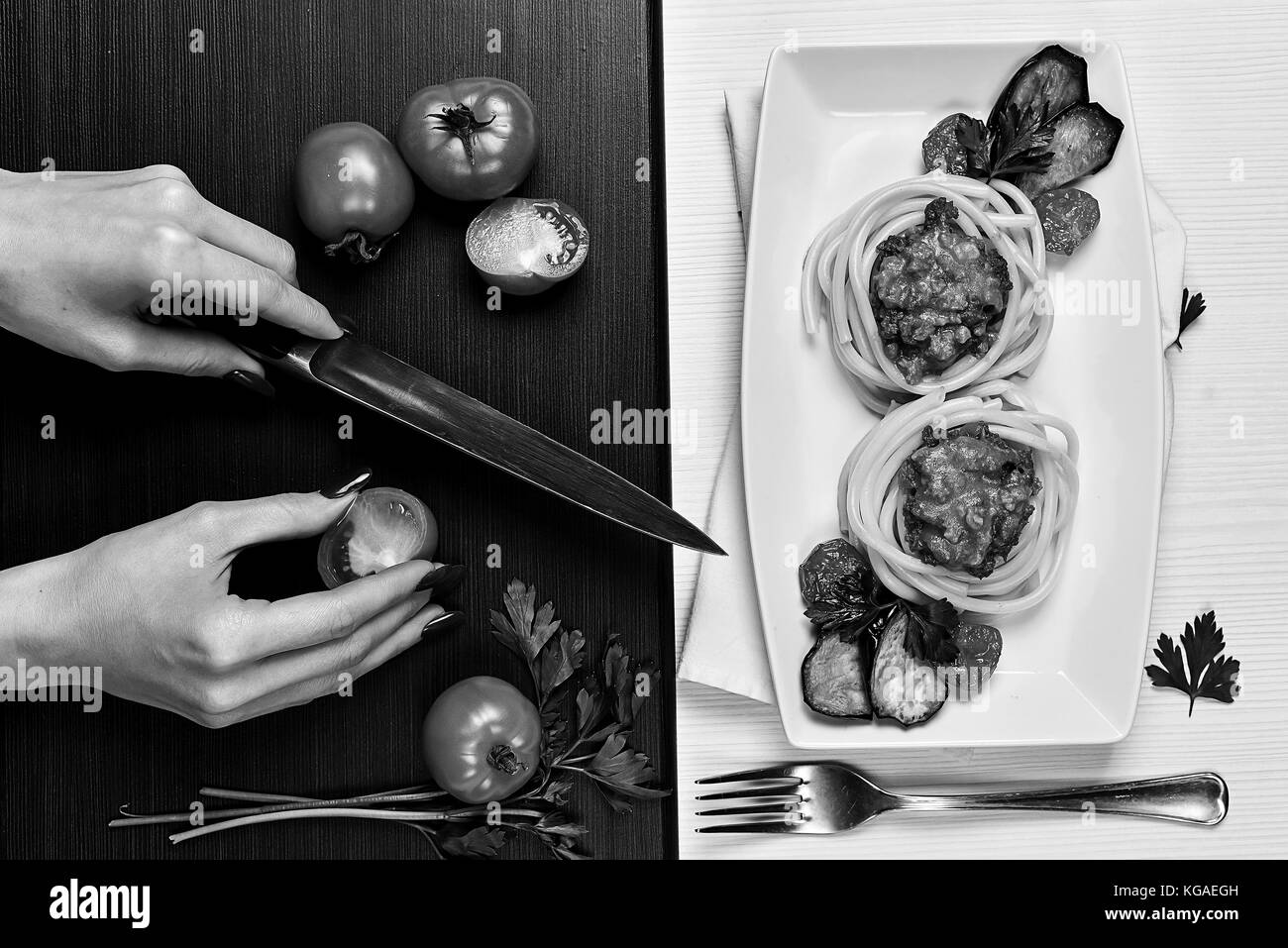 Dinner in the restaurant. Hands plates of food. Fork for eating Stock ...