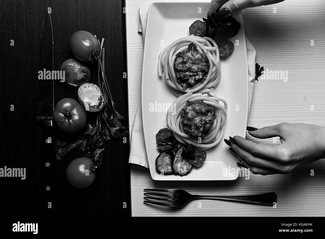 Dinner in the restaurant. Hands plates of food. Fork for eating Stock ...