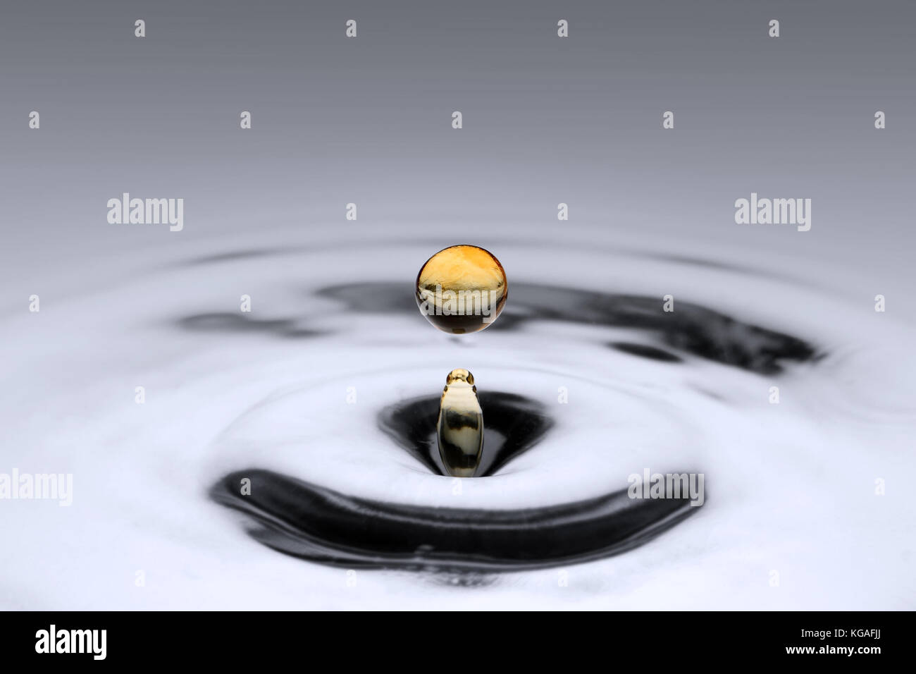 Colored water drop splash Stock Photo - Alamy