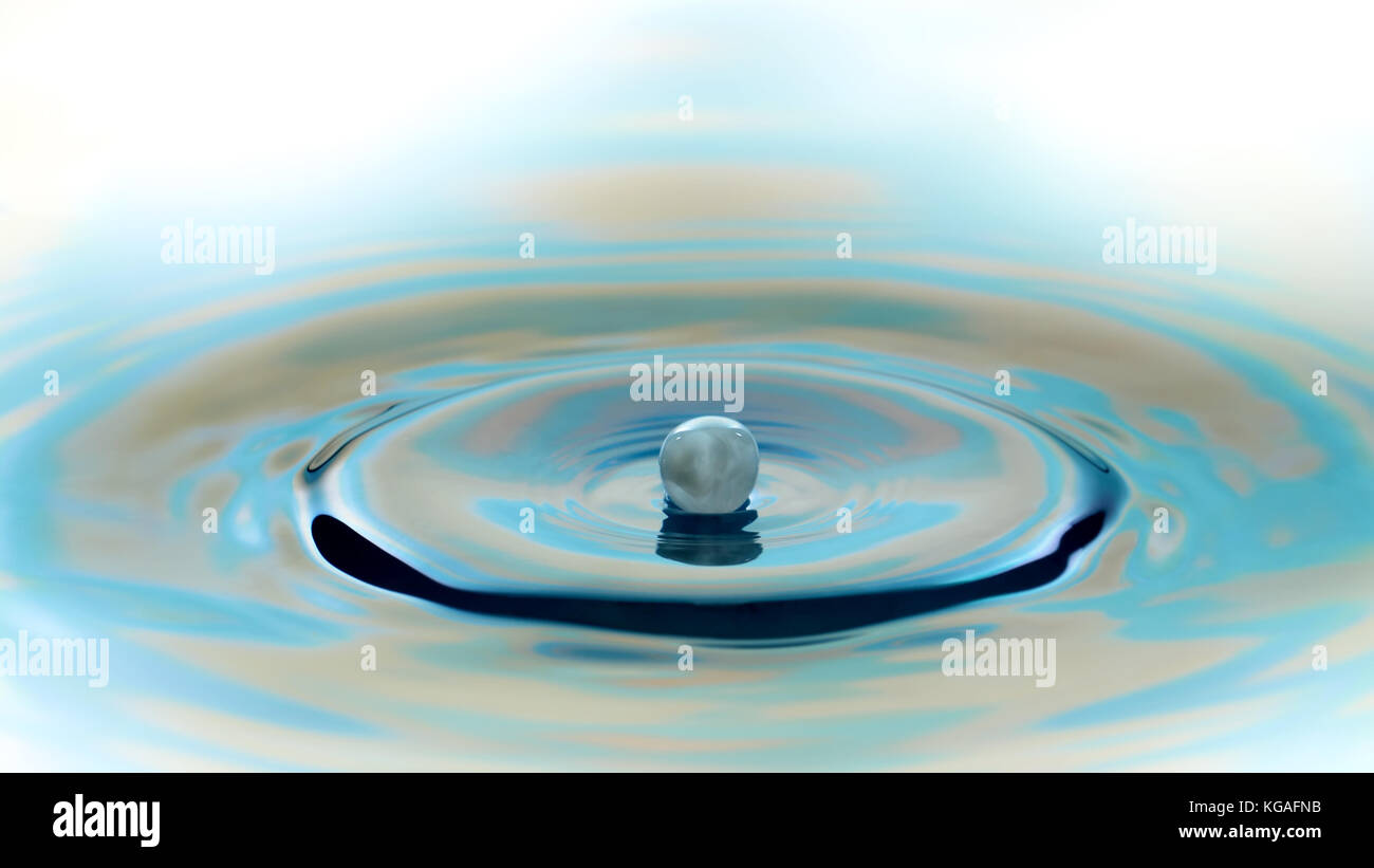 colored water drop splash Stock Photo - Alamy