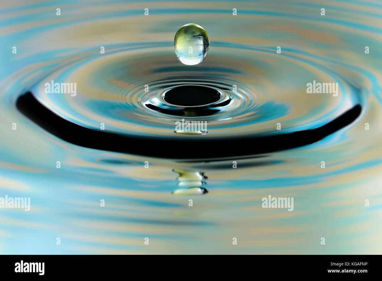 Colored water drop splash Stock Photo - Alamy