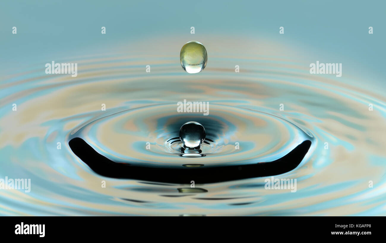Colored water drop splash Stock Photo - Alamy