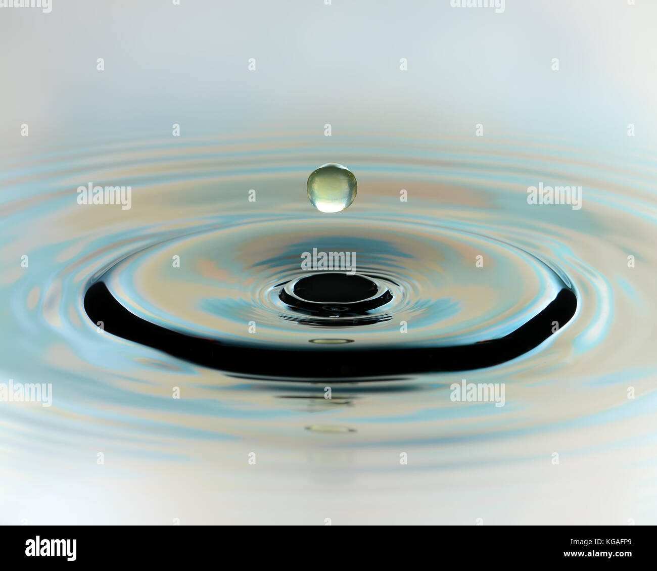 Colored water drop splash Stock Photo - Alamy